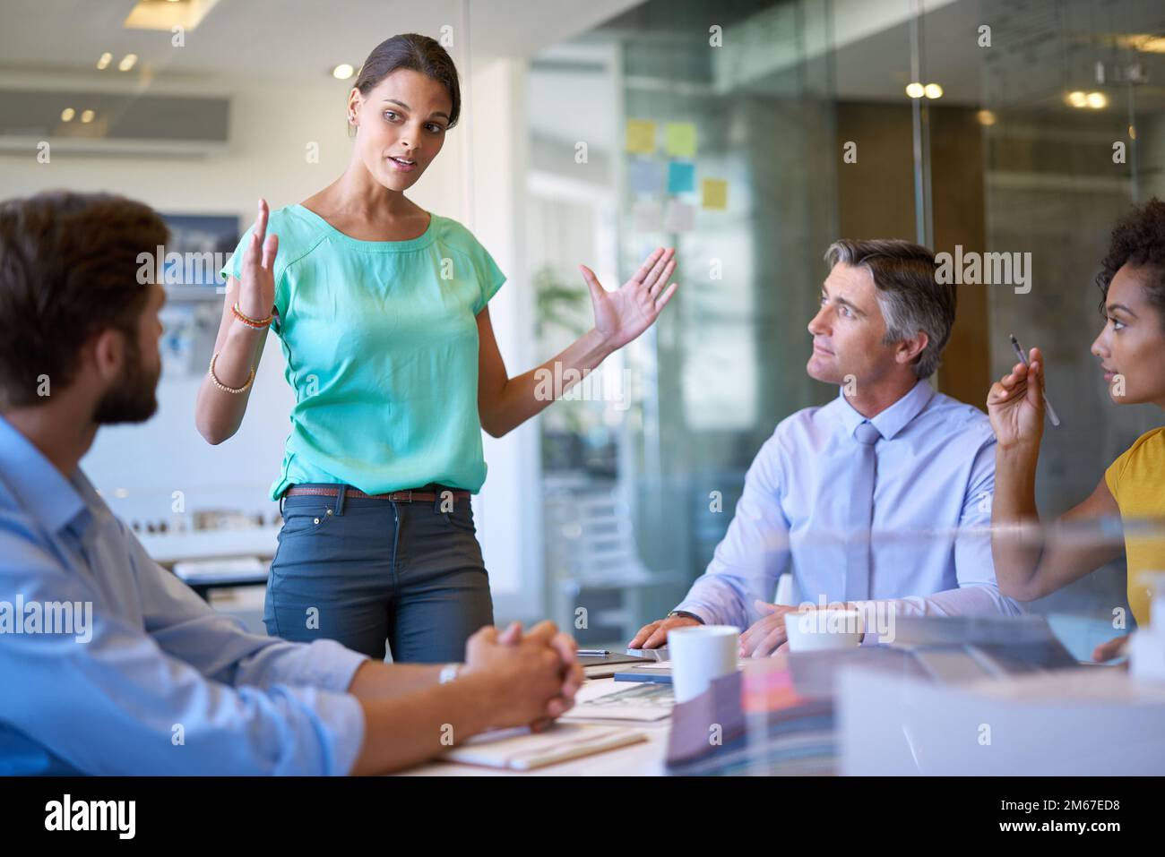 Im thinking something bigger. a group of businesspeople in a meeting ...