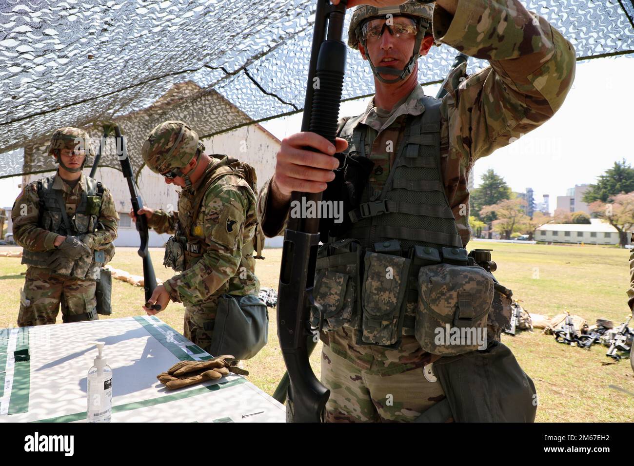 A U.S. Army Japan soldier maintains a shotgun during day two of the ...