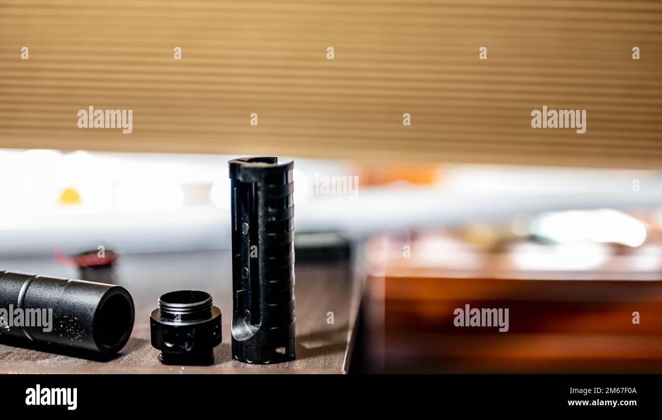 Assorted parts to build a laser sword from a kit with a hilt, neon ...