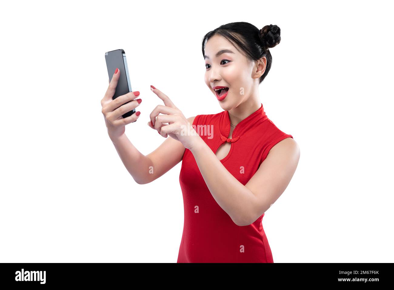 Asian Chinese woman in a cheongsam dress using a mobile phone isolated ...