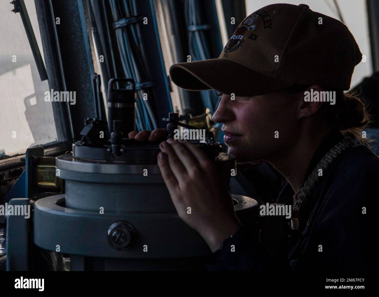 STRAIT OF HORMUZ (April 12, 2022) Ensign Emily Craig checks the bearing ...