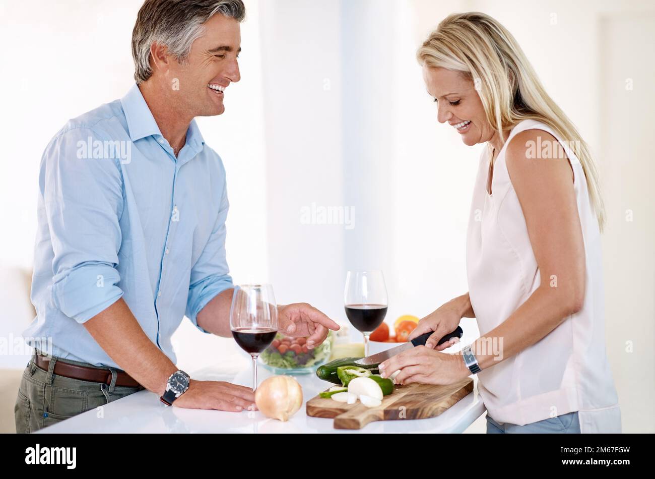 Happiness and a hearty meal. a mature couple enjoying wine and talking ...