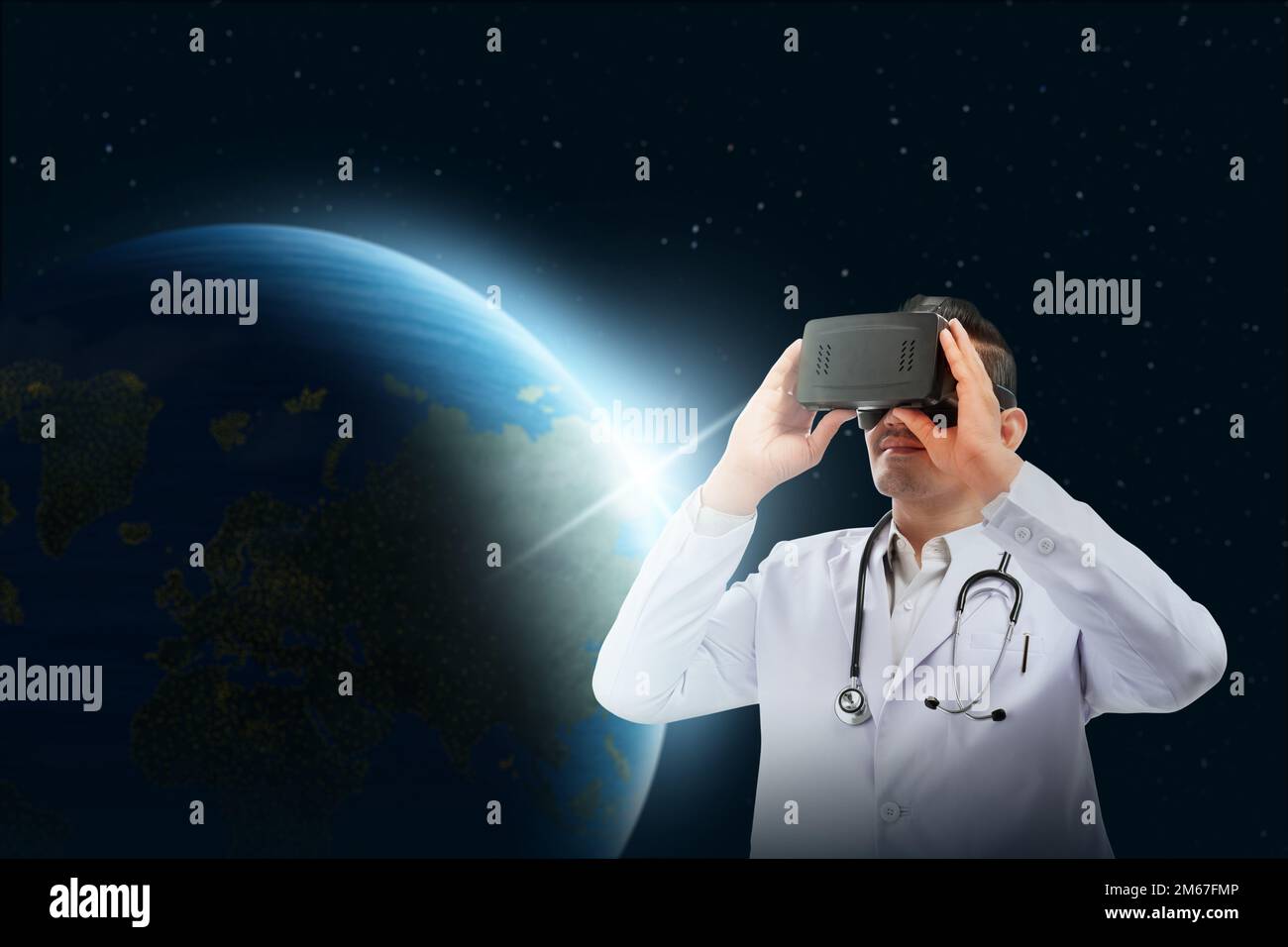 Asian male doctor with a stethoscope using virtual reality with earth ...