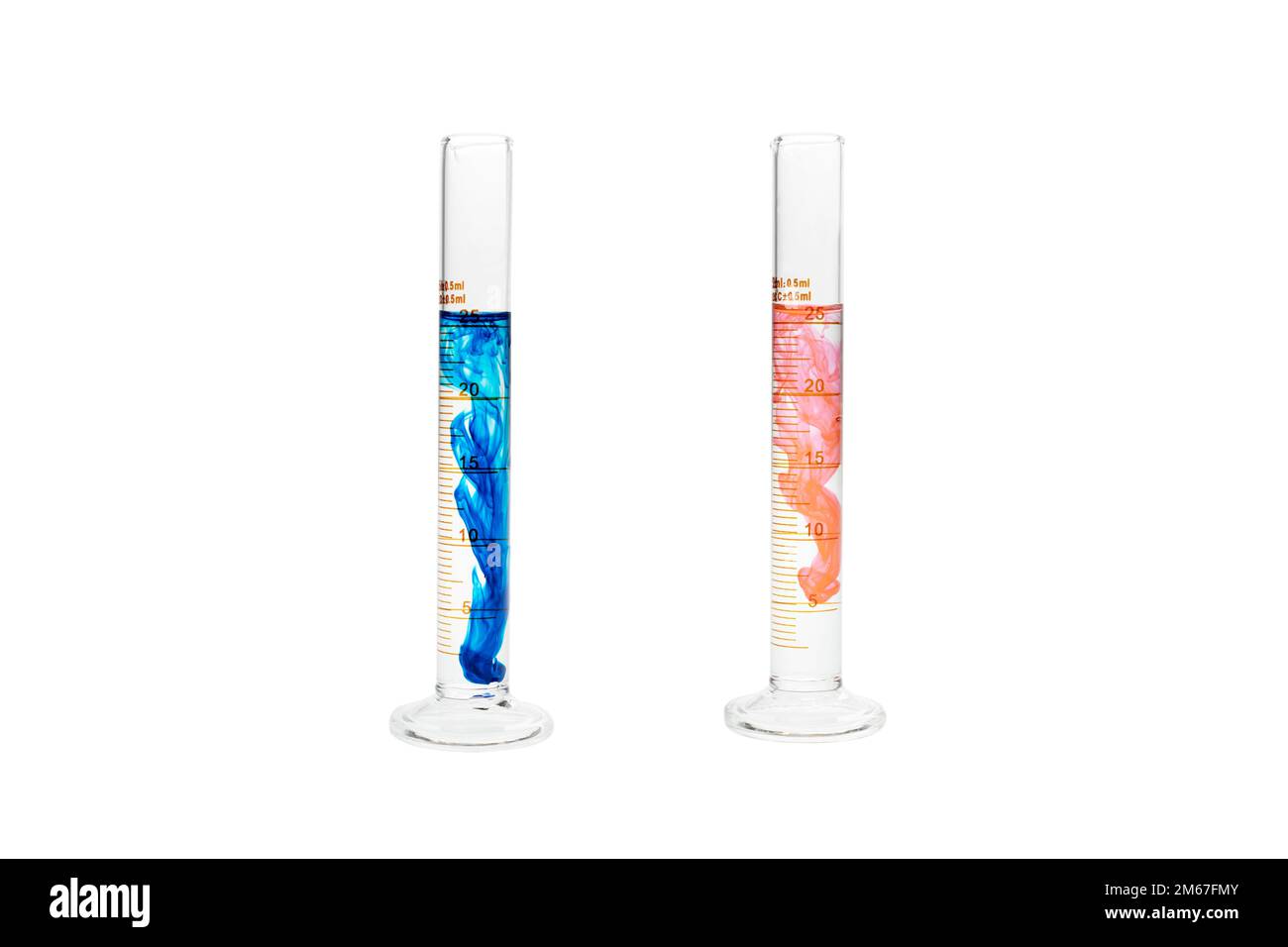 Colorful chemicals in laboratory glassware isolated over white ...