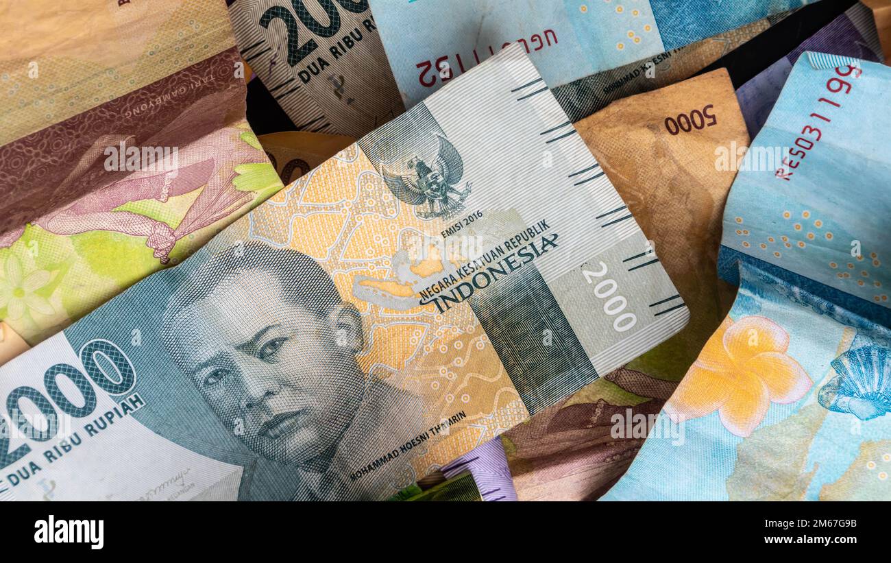 pile of rupiah banknotes as background Stock Photo - Alamy
