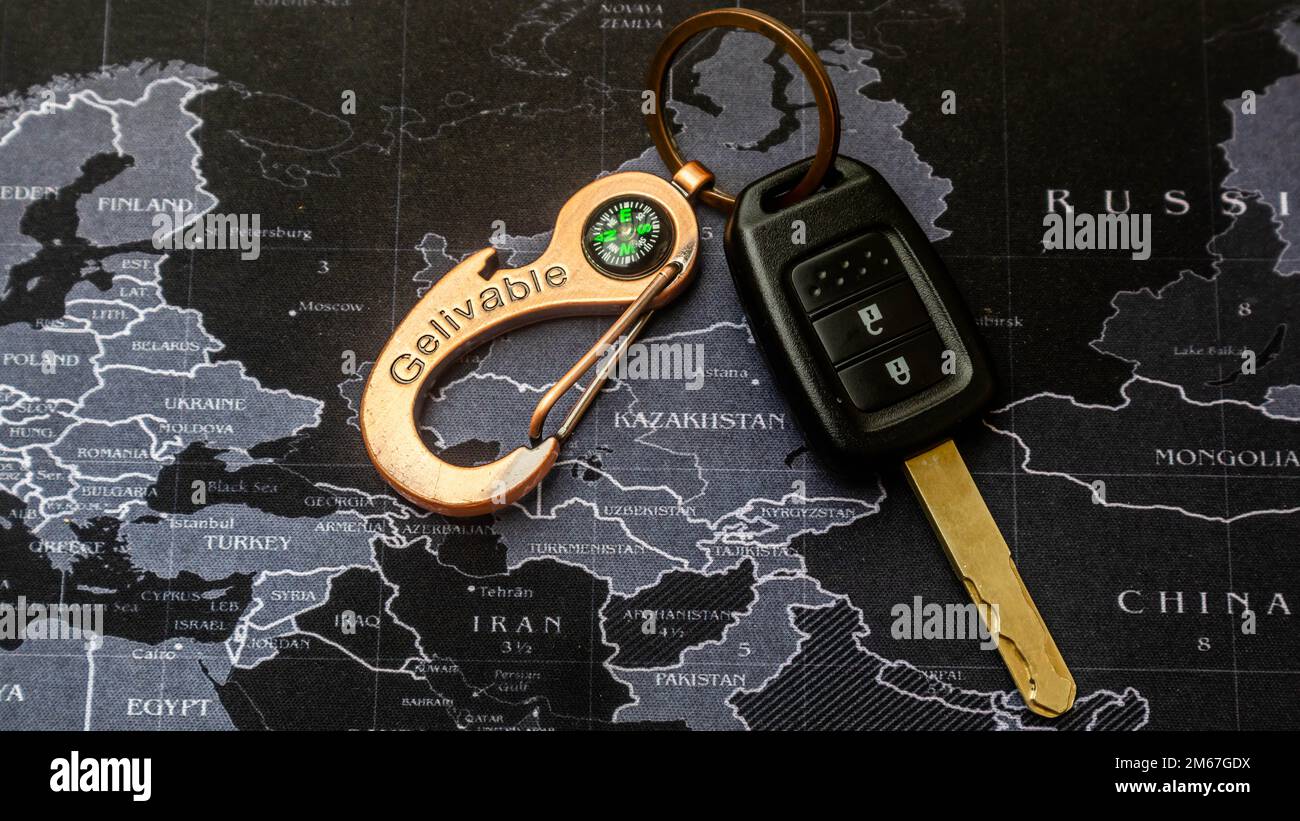 black car key over black map Stock Photo - Alamy