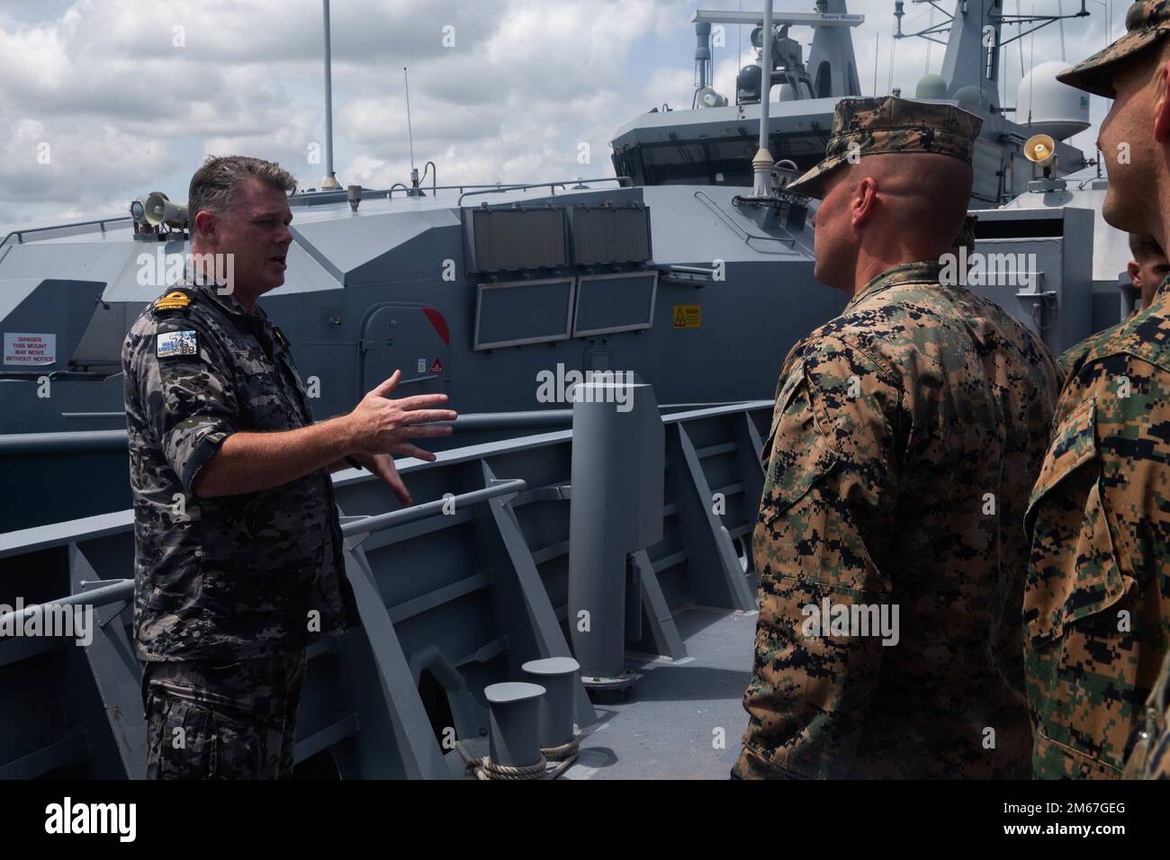 Royal Australian Navy Lt. Cmdr. Adrian Hicks (left), the commanding ...