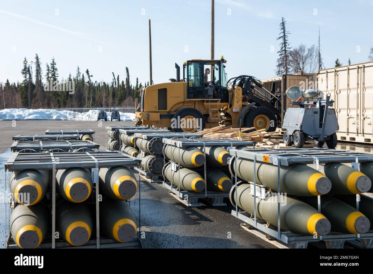 U.S. Airmen with the 3rd Munitions Squadron offload BLU-111 munitions ...