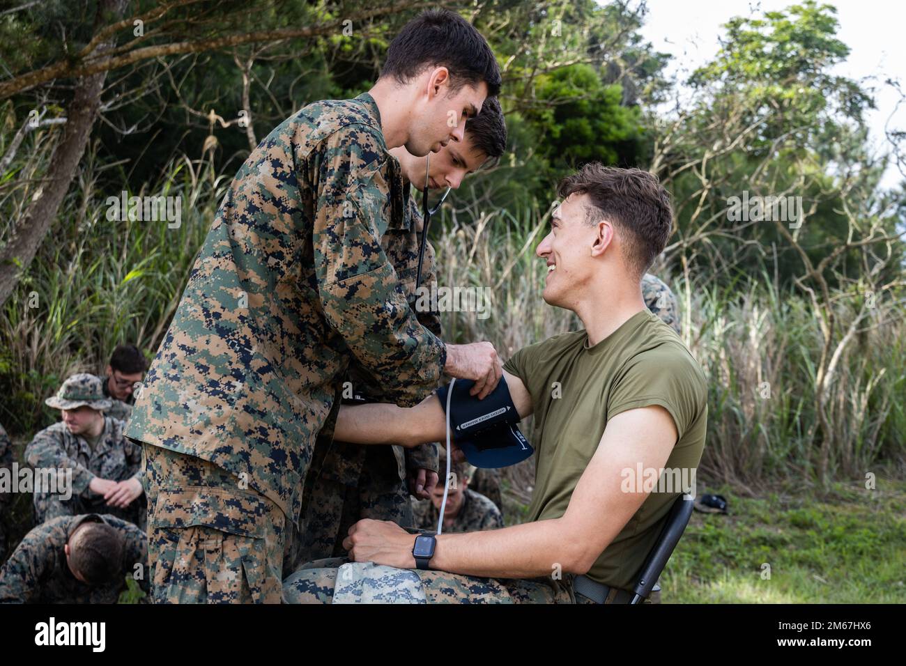 U.S. Navy Petty Officer 2nd Class Joseph Nichols, left, a hospital ...