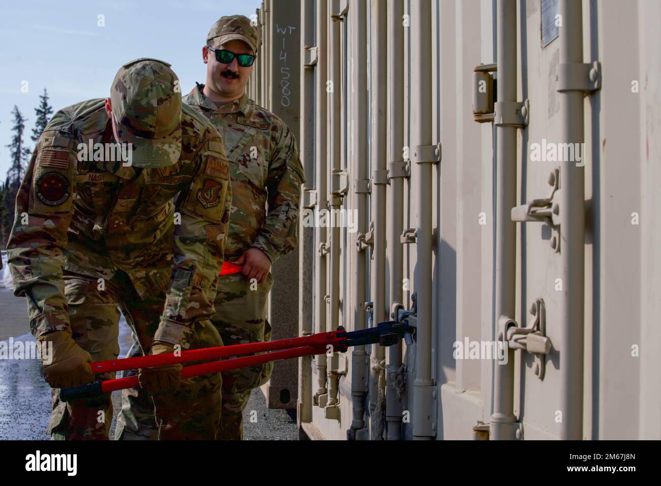 U.S. Air Force Airmen assigned to the 3rd Munitions Squadron open a ...