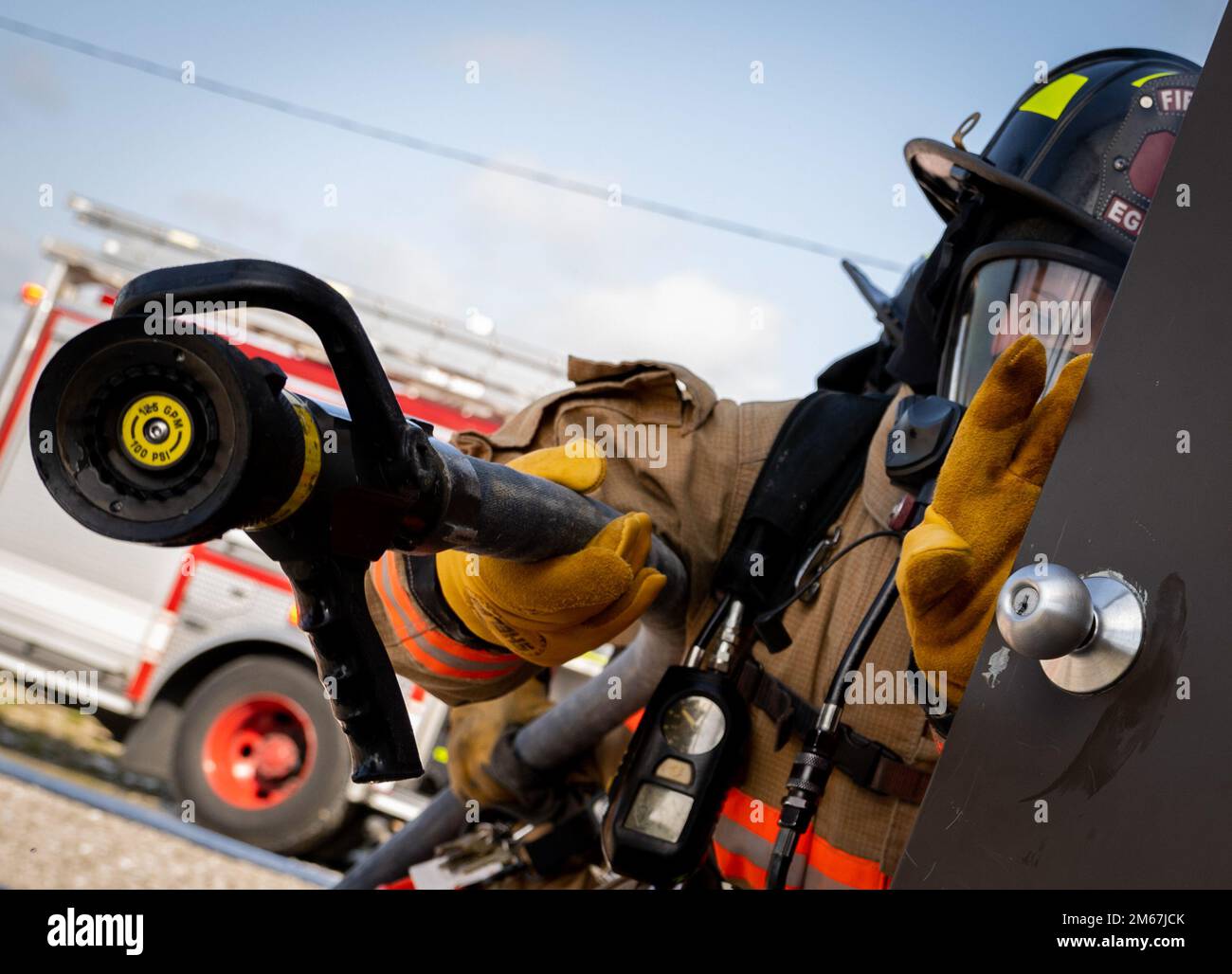 Journey Collier, a 96th Civil Engineer Squadron firefighter, opens a ...