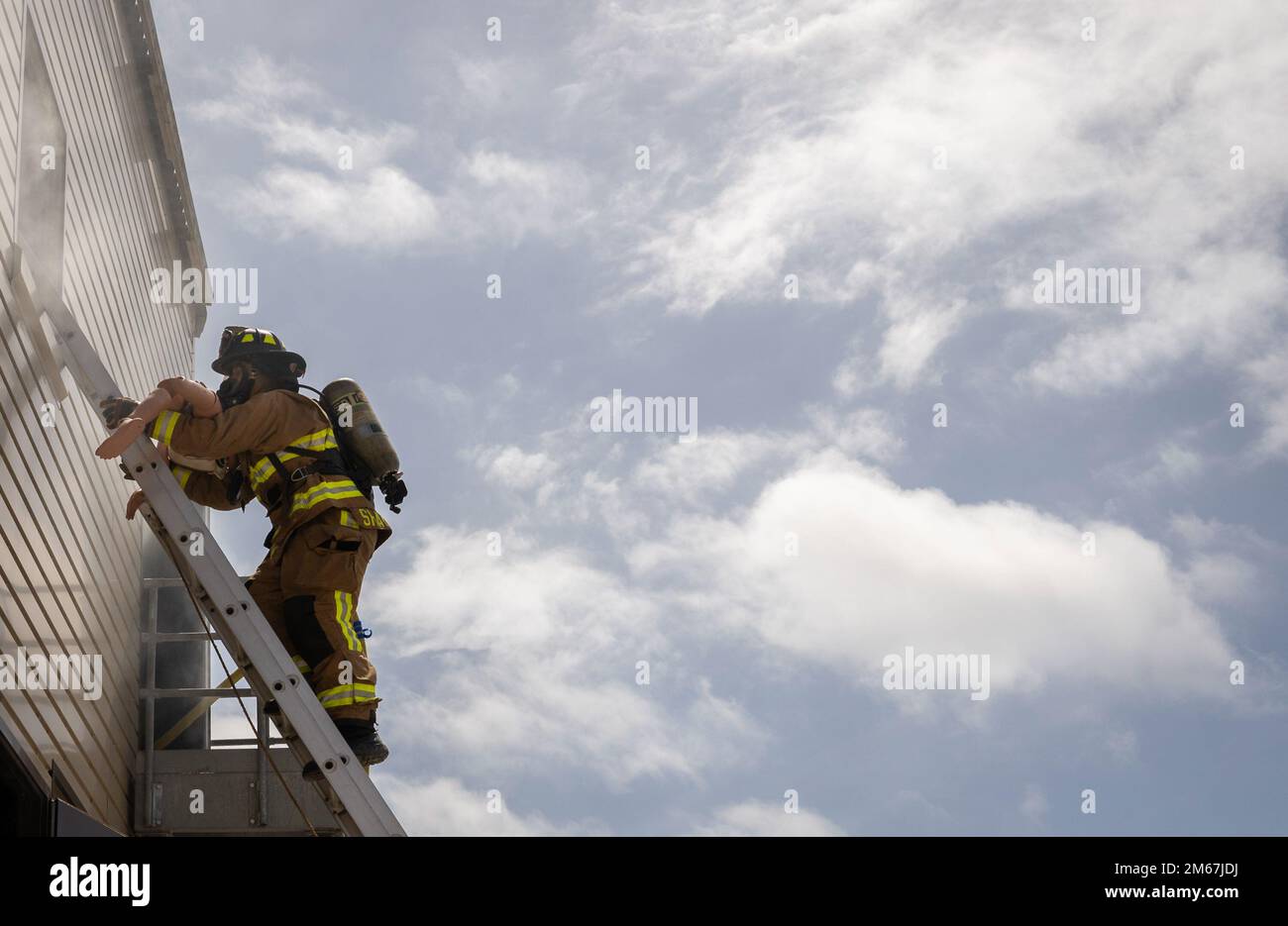 A 96th Civil Engineer Squadron firefighter removes a simulated victim ...
