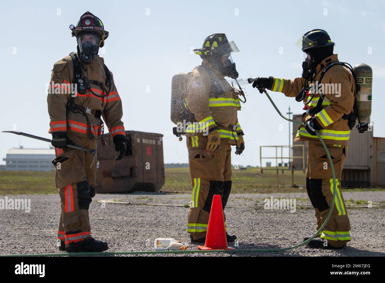 A 96th Civil Engineer Squadron firefighter receives a rinse off after ...