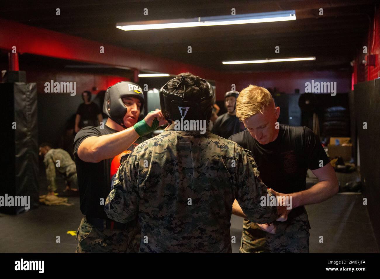 U.S. Marine Corps SSgt. James Jernigan, right, Marine Arts Instructor ...