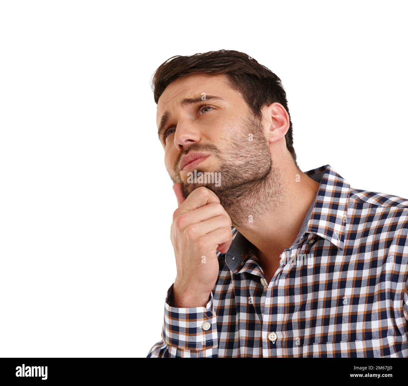 I know this...Studio shot of a handsome young man racking his brain for ...