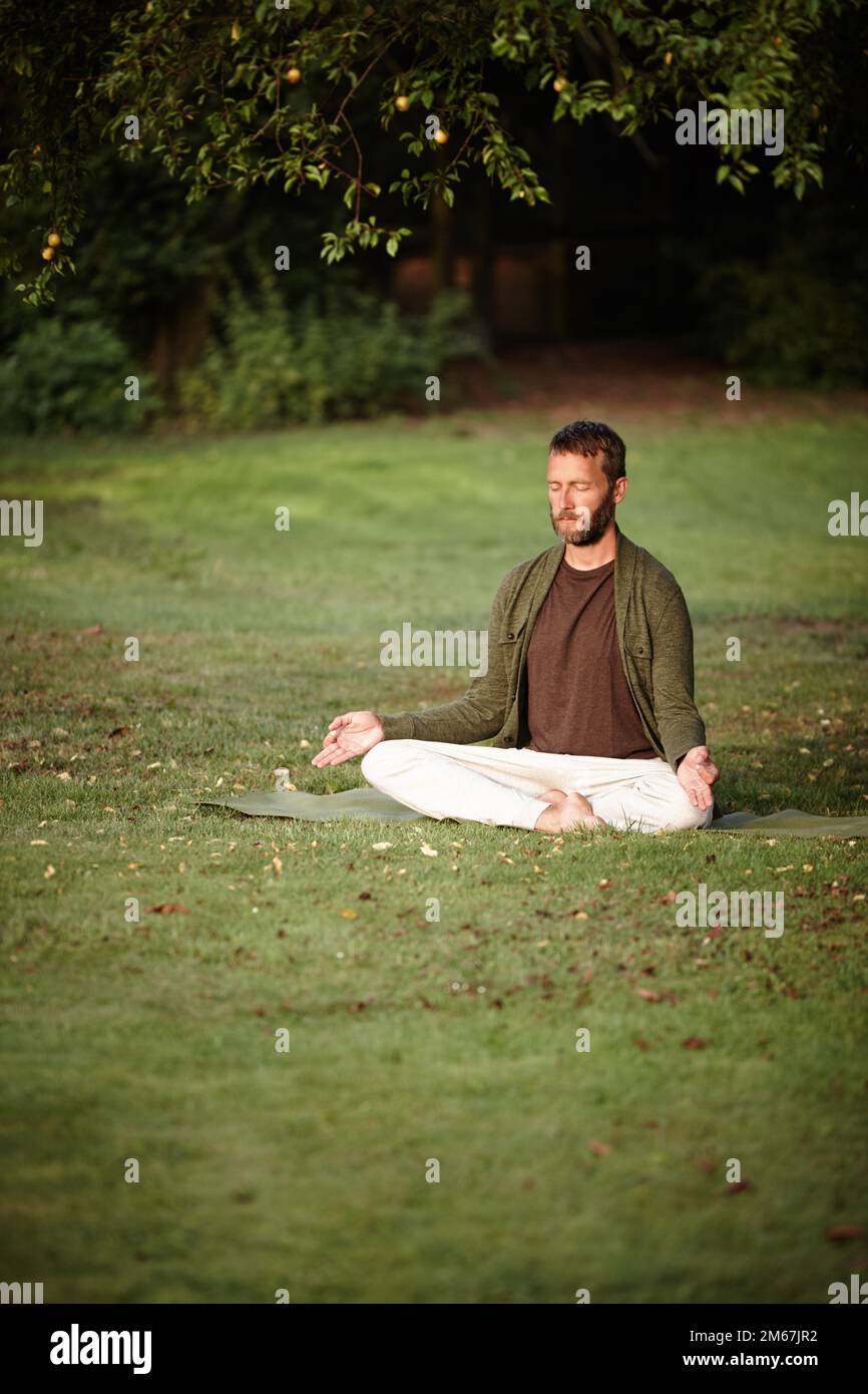 One handsome man meditating hi-res stock photography and images - Alamy