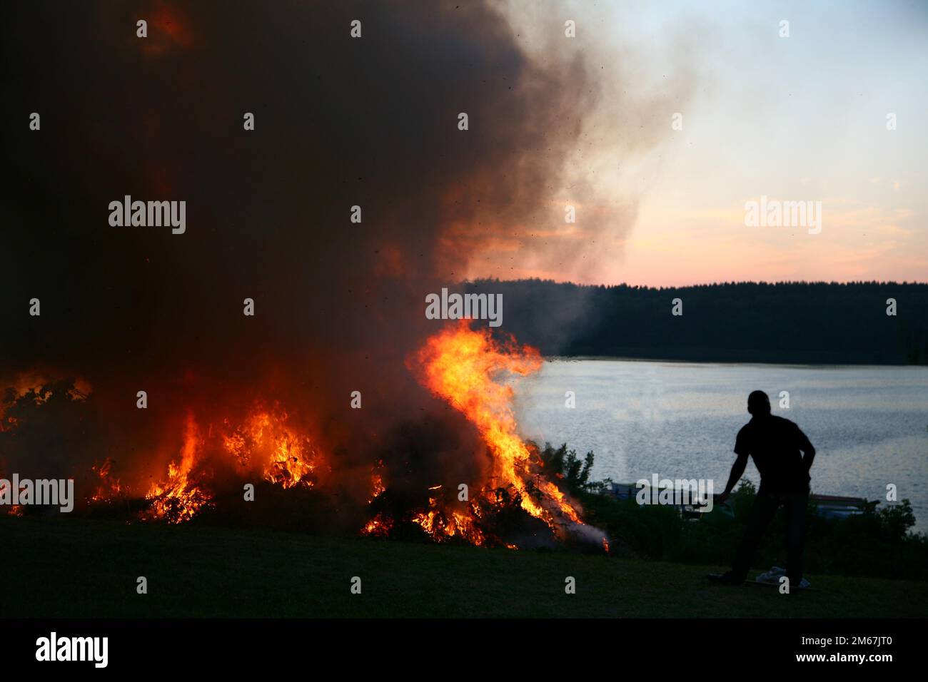 Controlled fire of trees and branches for the Saint John's fire in ...
