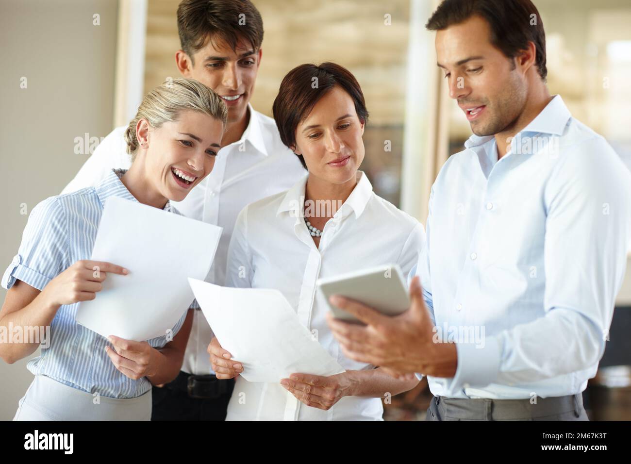 Teamwork gets the job done. a group of business colleagues working ...