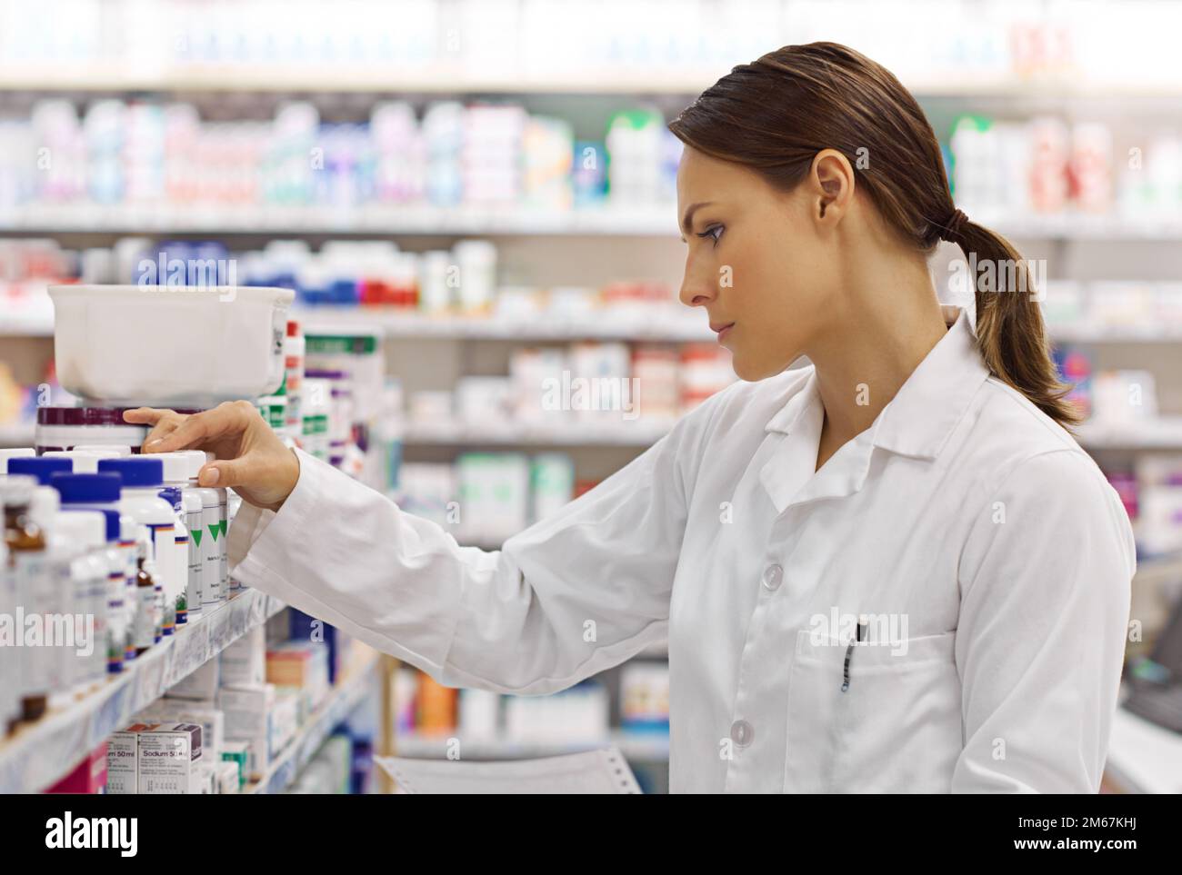 Finding the perfect prescription for her customers needs. an attractive ...
