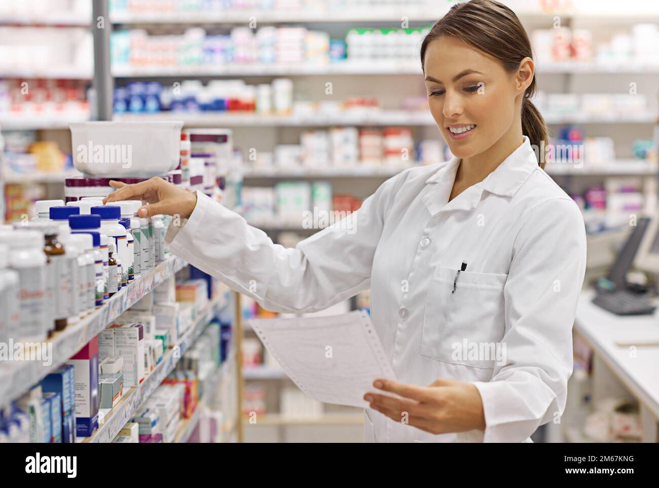 Ensuring the proper prescriptions are filled. an attractive young ...