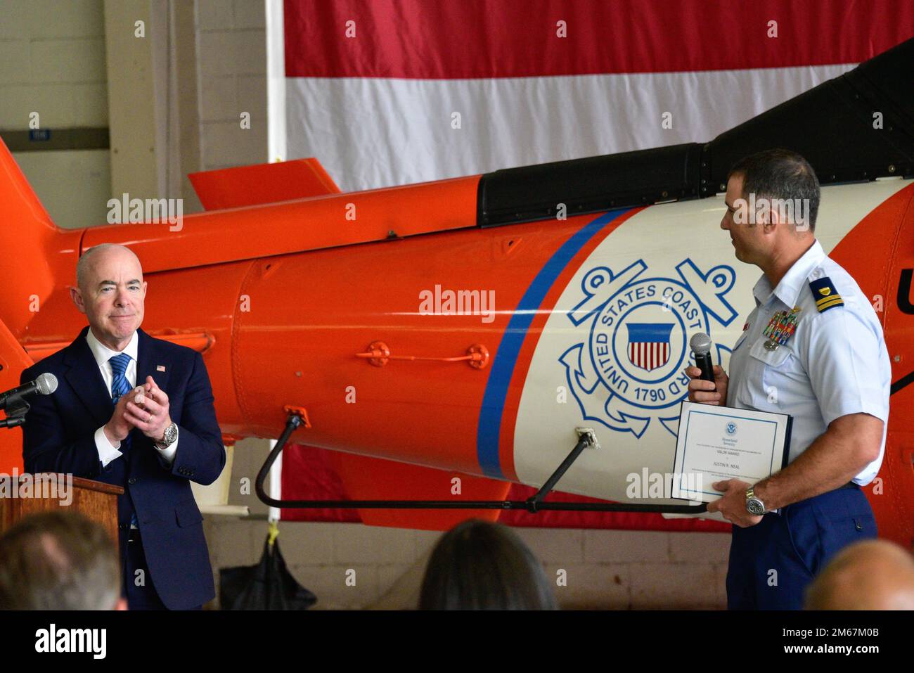 Secretary of Homeland Security Alejandro Mayorkas clapping at an awards ...
