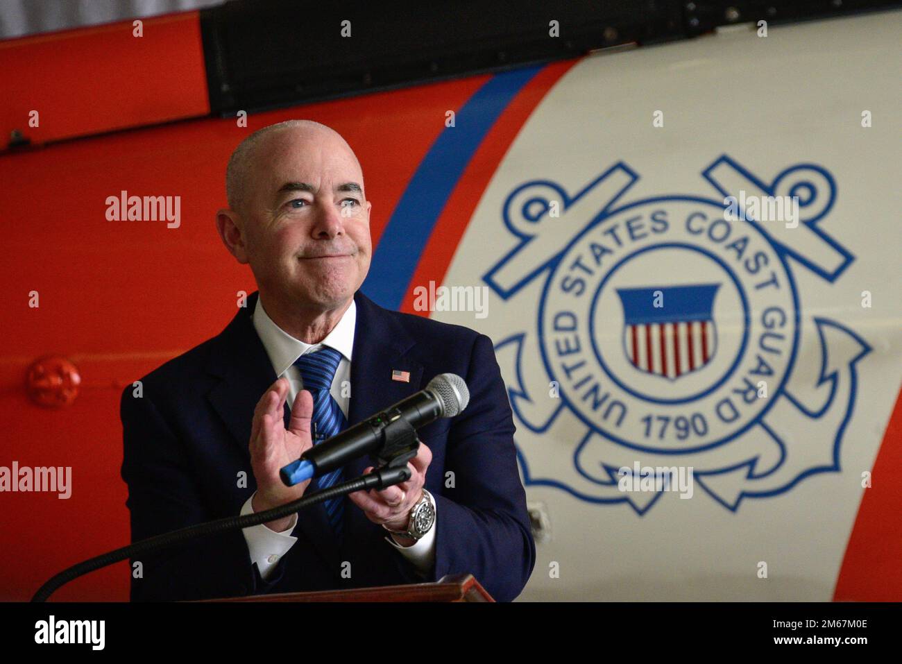 Secretary of Homeland Security Alejandro Mayorkas clapping at an awards ...