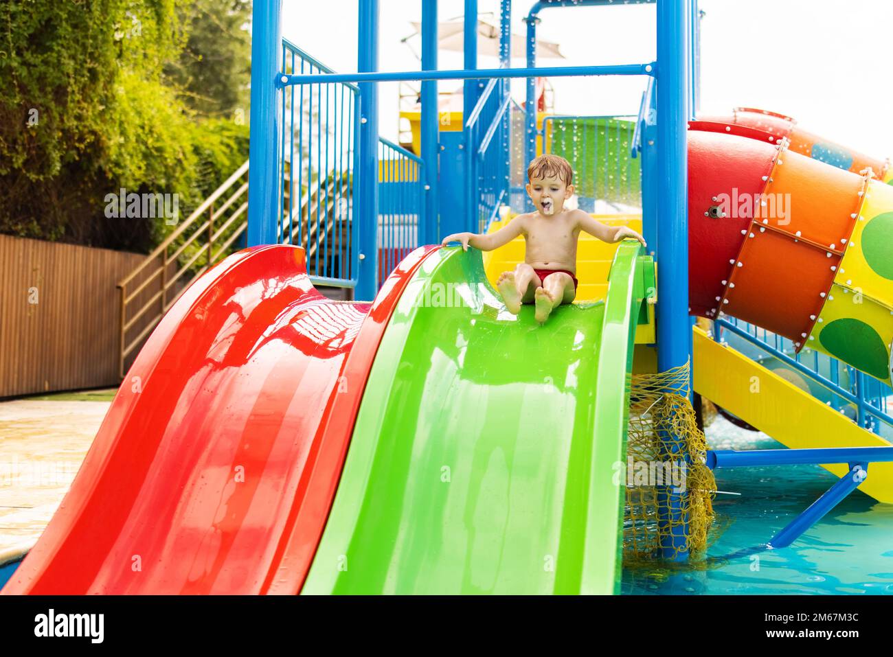 Water slide boy hi-res stock photography and images - Alamy