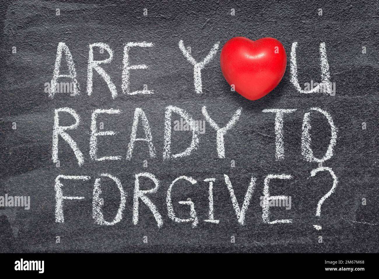 are you ready to forgive question written on chalkboard with red heart ...