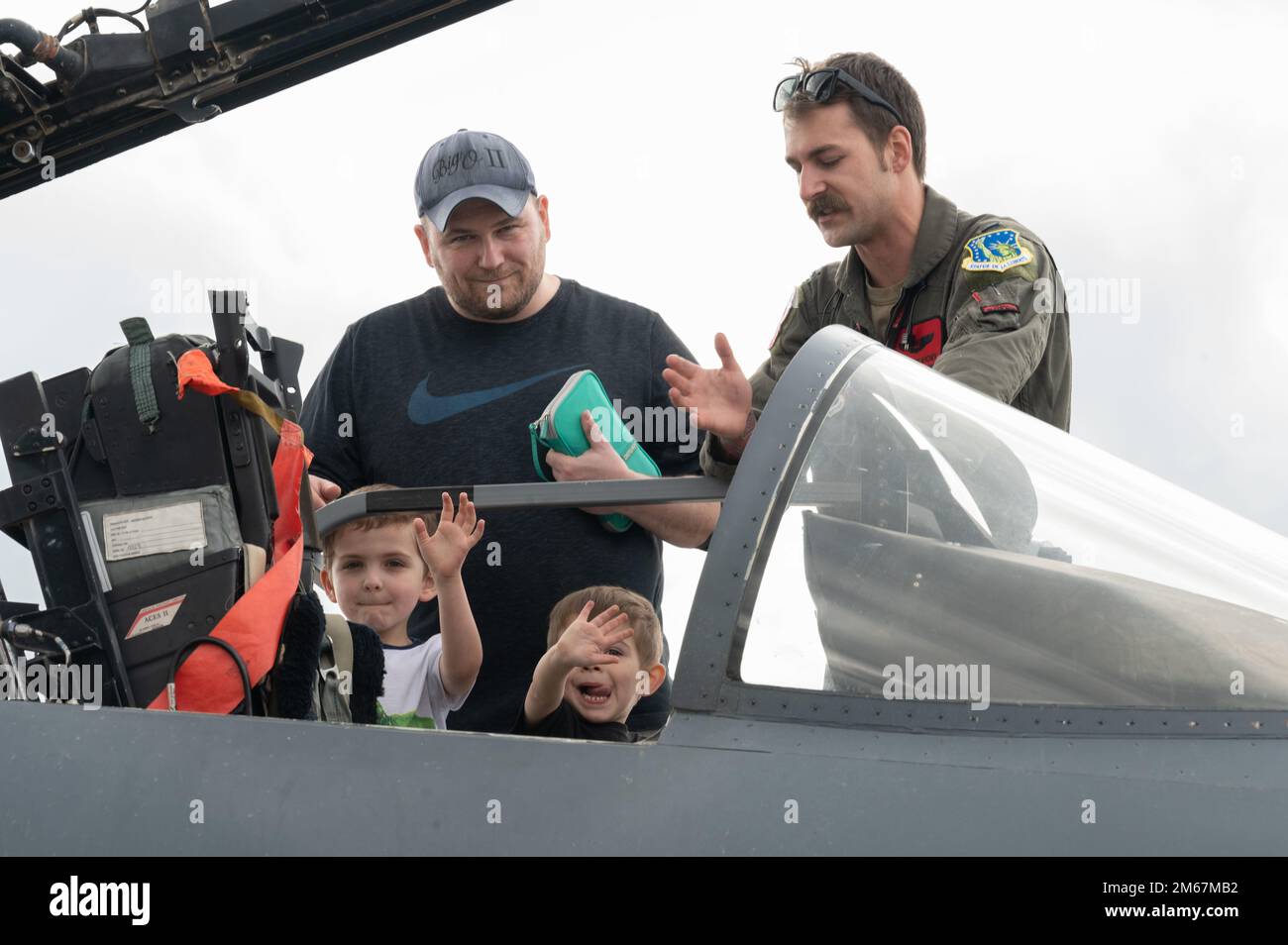 A parent and his children from the 48th Fighter Wing learn about the F ...