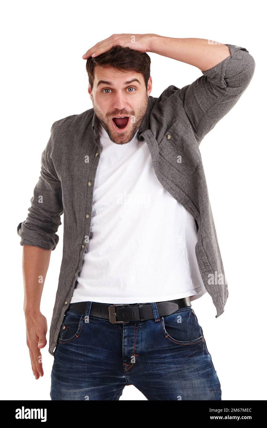 Oh no you didnt. Studio shot of a young man holding his head and ...