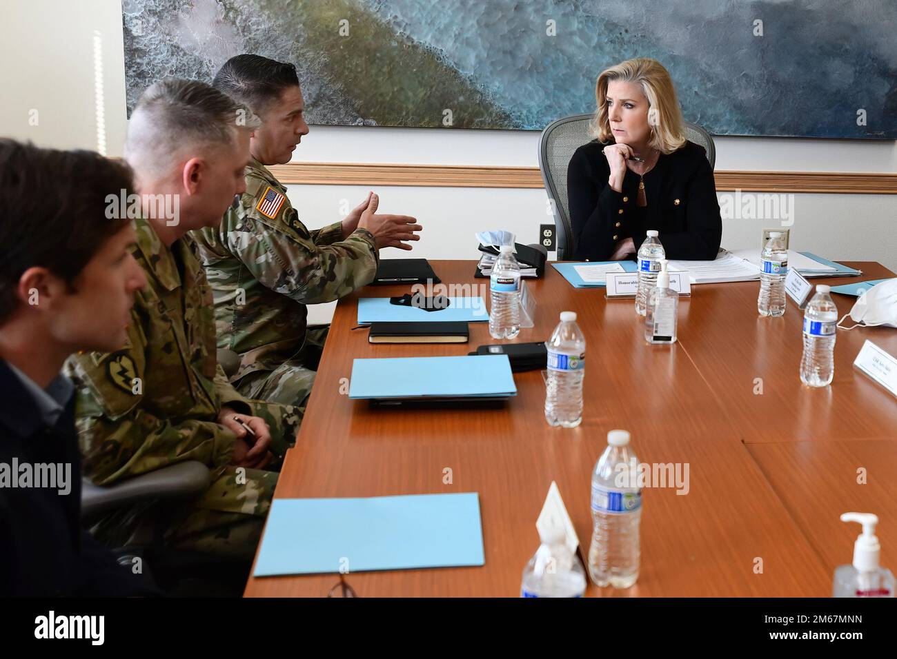 Secretary of the Army Christine Wormuth listens as Col. Eli Lozano ...