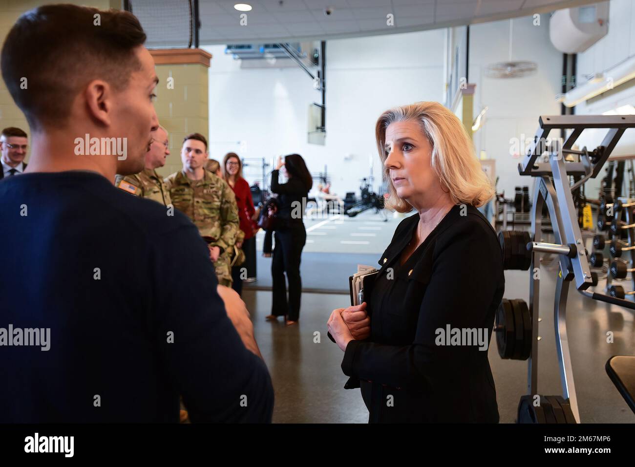 Buckner Physical Fitness Center director John Limon talks to Secretary ...
