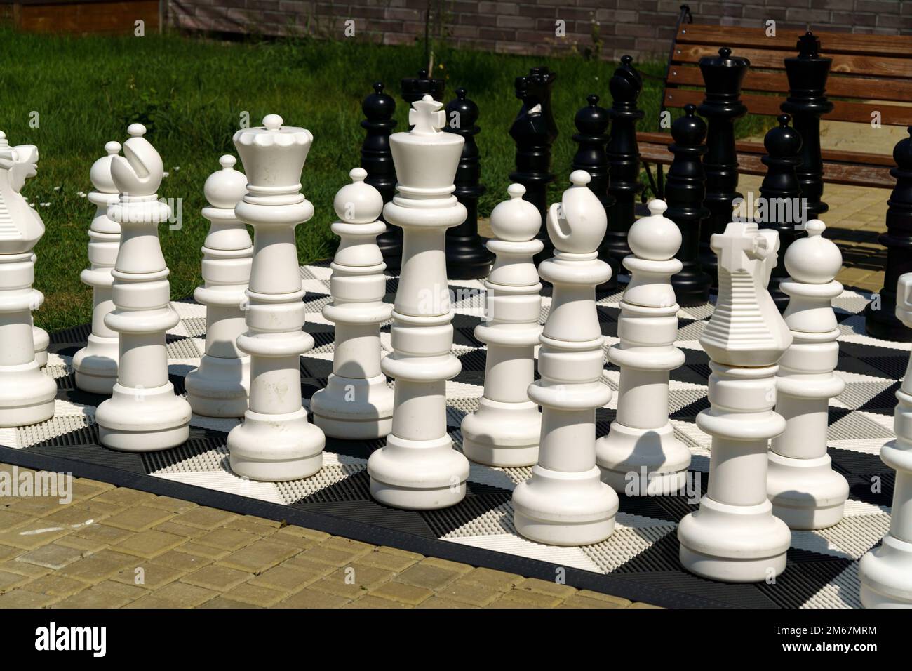 Outdoor chess board with big plastic pieces. Outdoor giant chess ...
