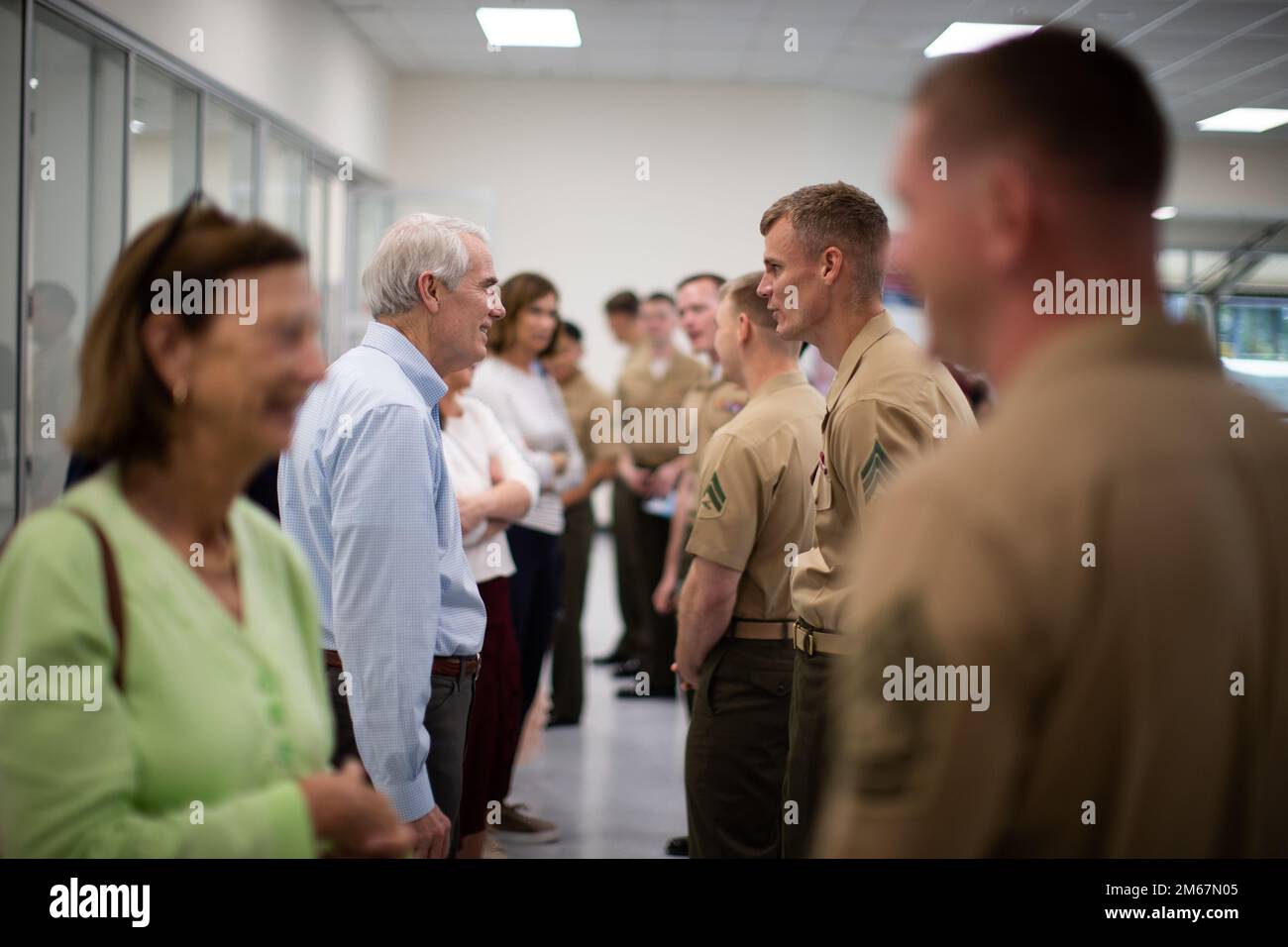 U.S. Senator Robert Portman speaks with U.S. Marine Corps Sgt. David ...
