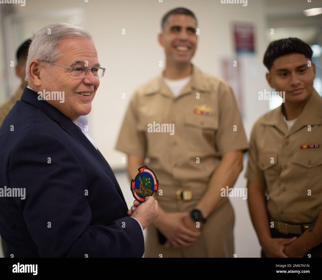 United States Senator Robert Menendez, holds up a Marine Rotational ...