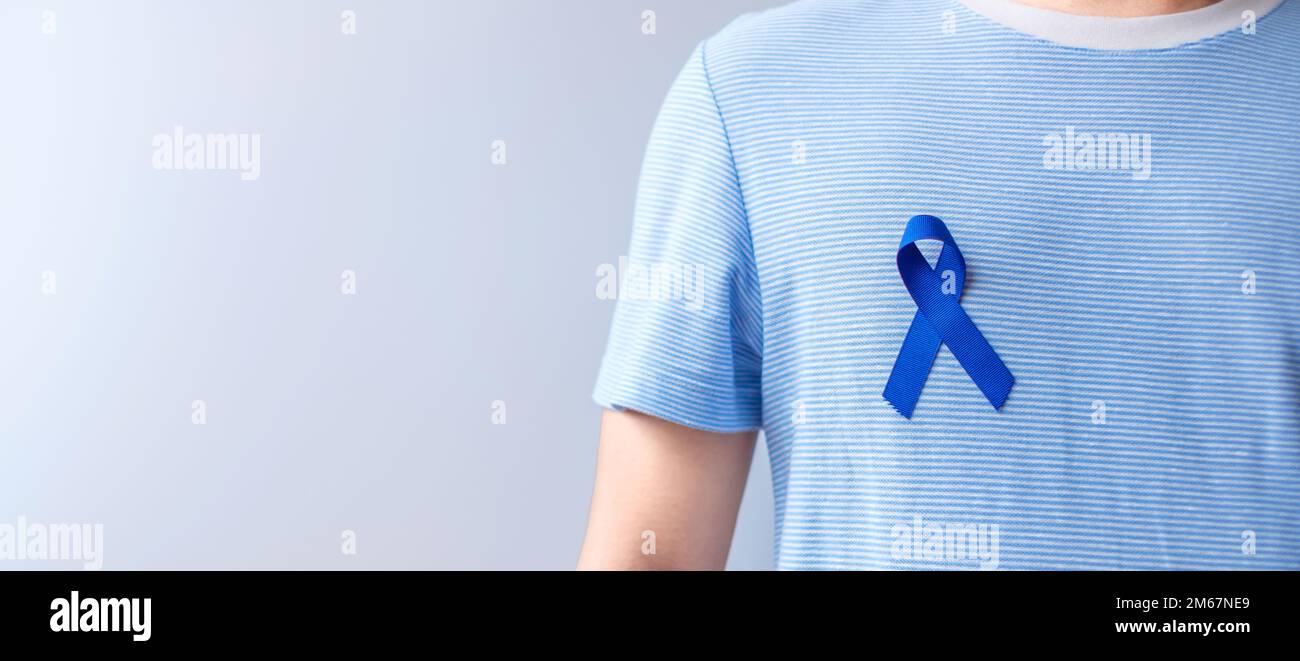 March Colorectal Cancer Awareness month, Woman holding dark Blue Ribbon ...