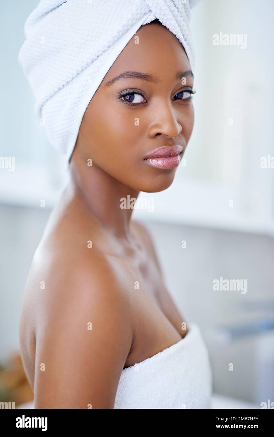 Time to get ready. a beautiful young woman during her daily beauty ...