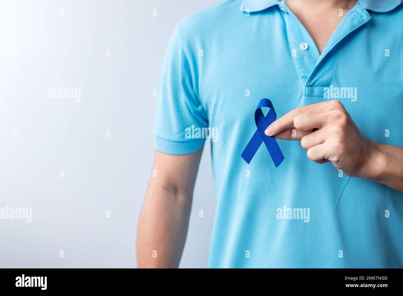 March Colorectal Cancer Awareness Month Woman Holding Dark Blue Ribbon