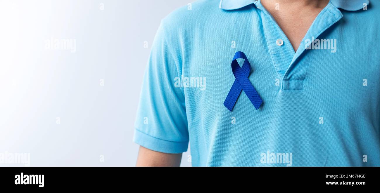March Colorectal Cancer Awareness Month Woman Holding Dark Blue Ribbon