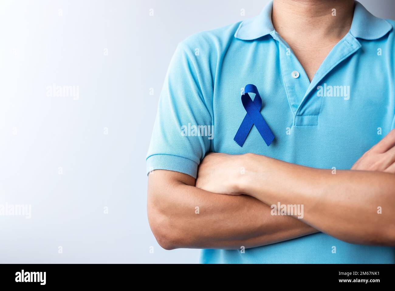 March Colorectal Cancer Awareness Month Woman Holding Dark Blue Ribbon