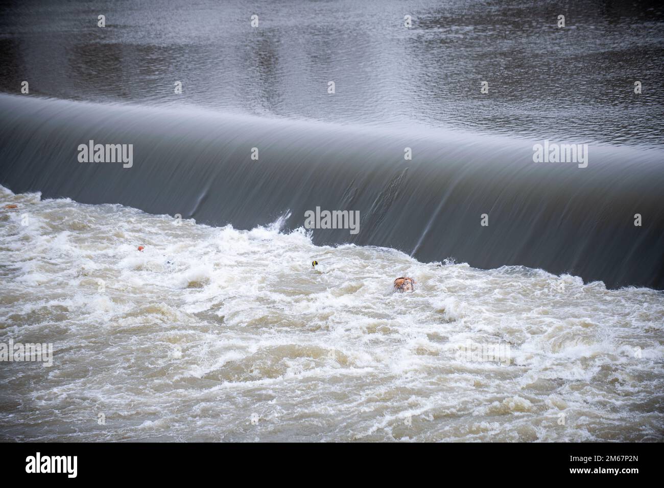 Water flows over the fixed-crest dam at C.W. Bill Young Lock & Dam ...