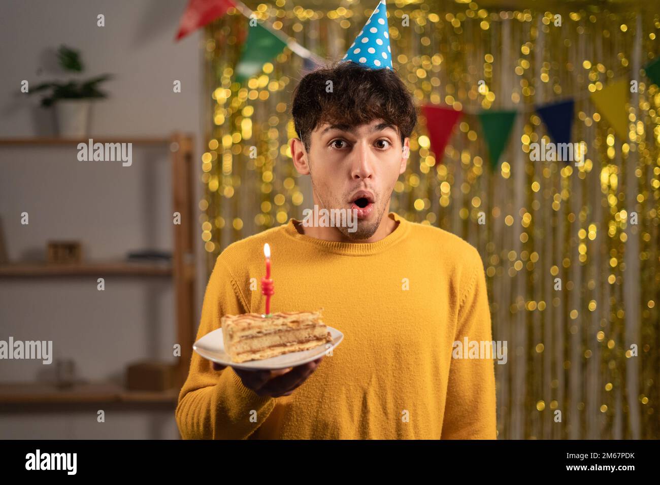 Shocked looking young man party hi-res stock photography and images - Alamy