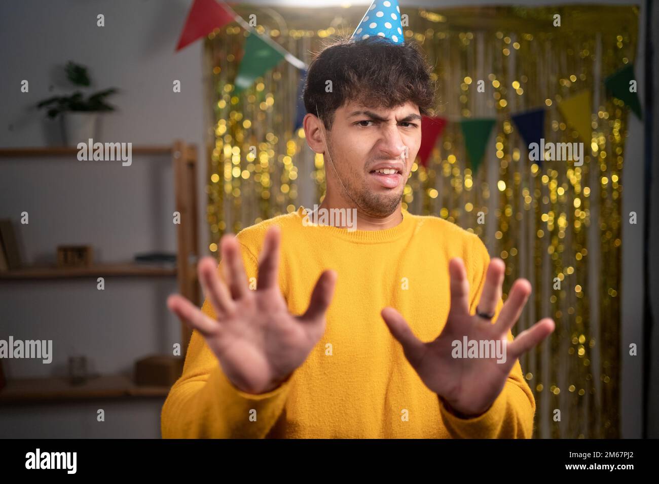 Photo of disgusted young man dislike gift look empty space bad mood at ...