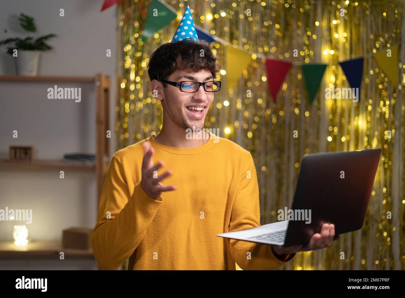 Virtual Party. Happy arabic man in hat having video conference online ...