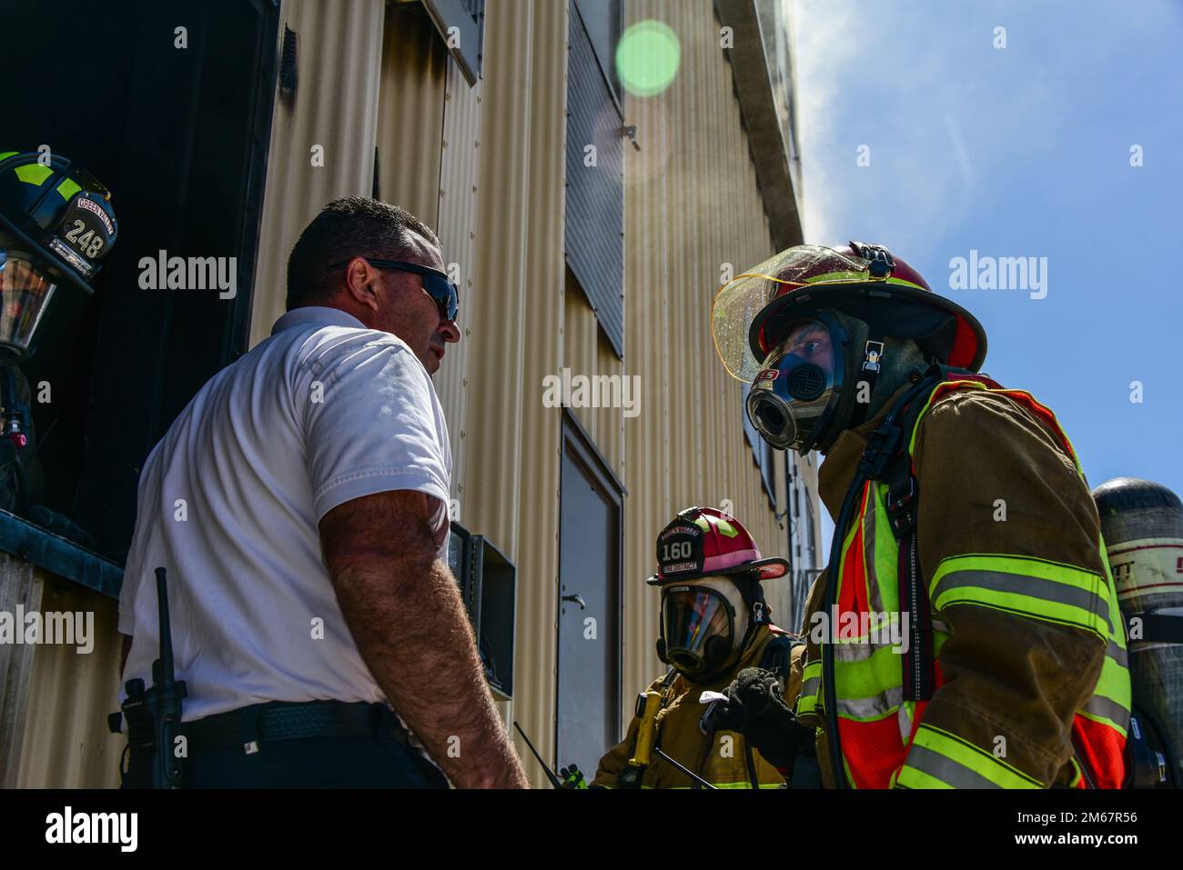 Local firefighters from the Green Valley Fire District work with Darren ...