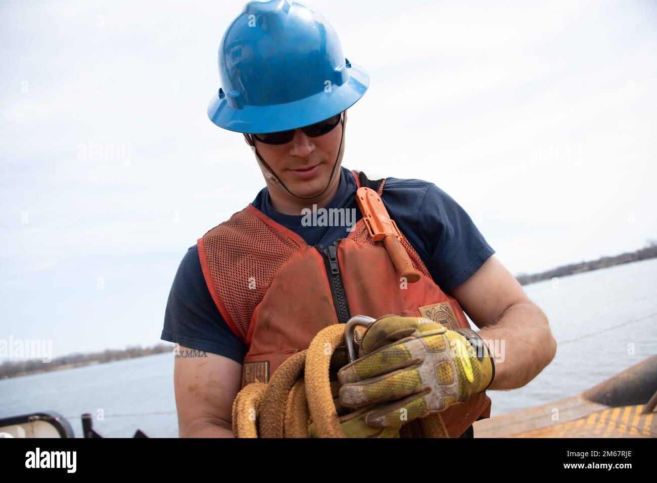Coast Guard crew members work aboard the U.S. Coast Guard Cutter ...