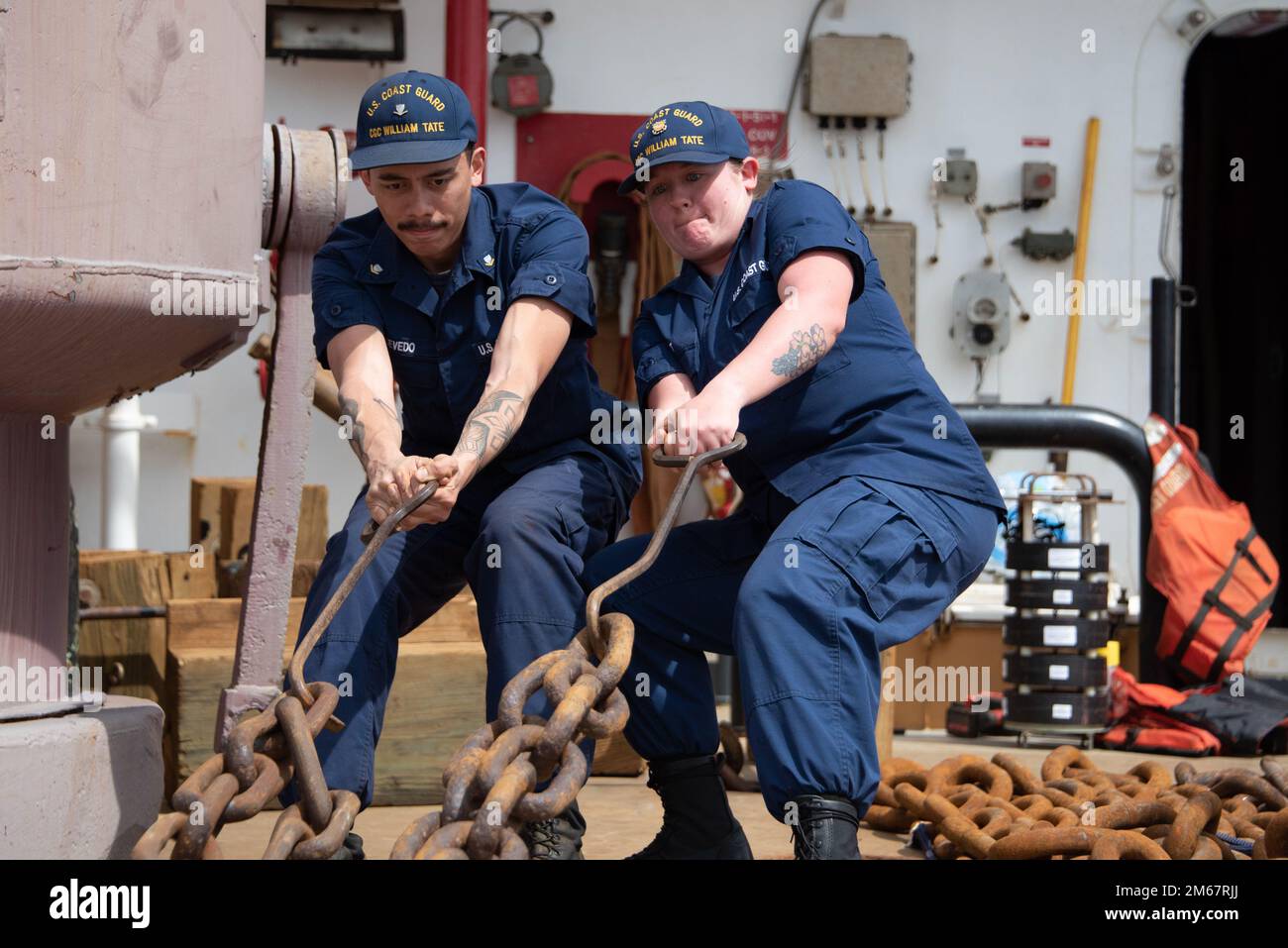 Coast Guard crew members work aboard the U.S. Coast Guard Cutter ...