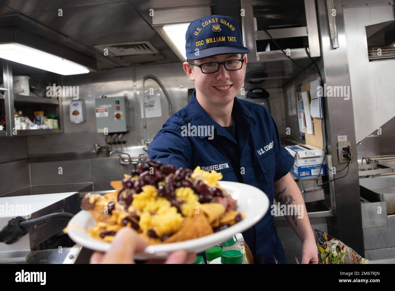 Coast Guard Seaman Dalton Shuffelbottom serves lunch aboard the U.S ...