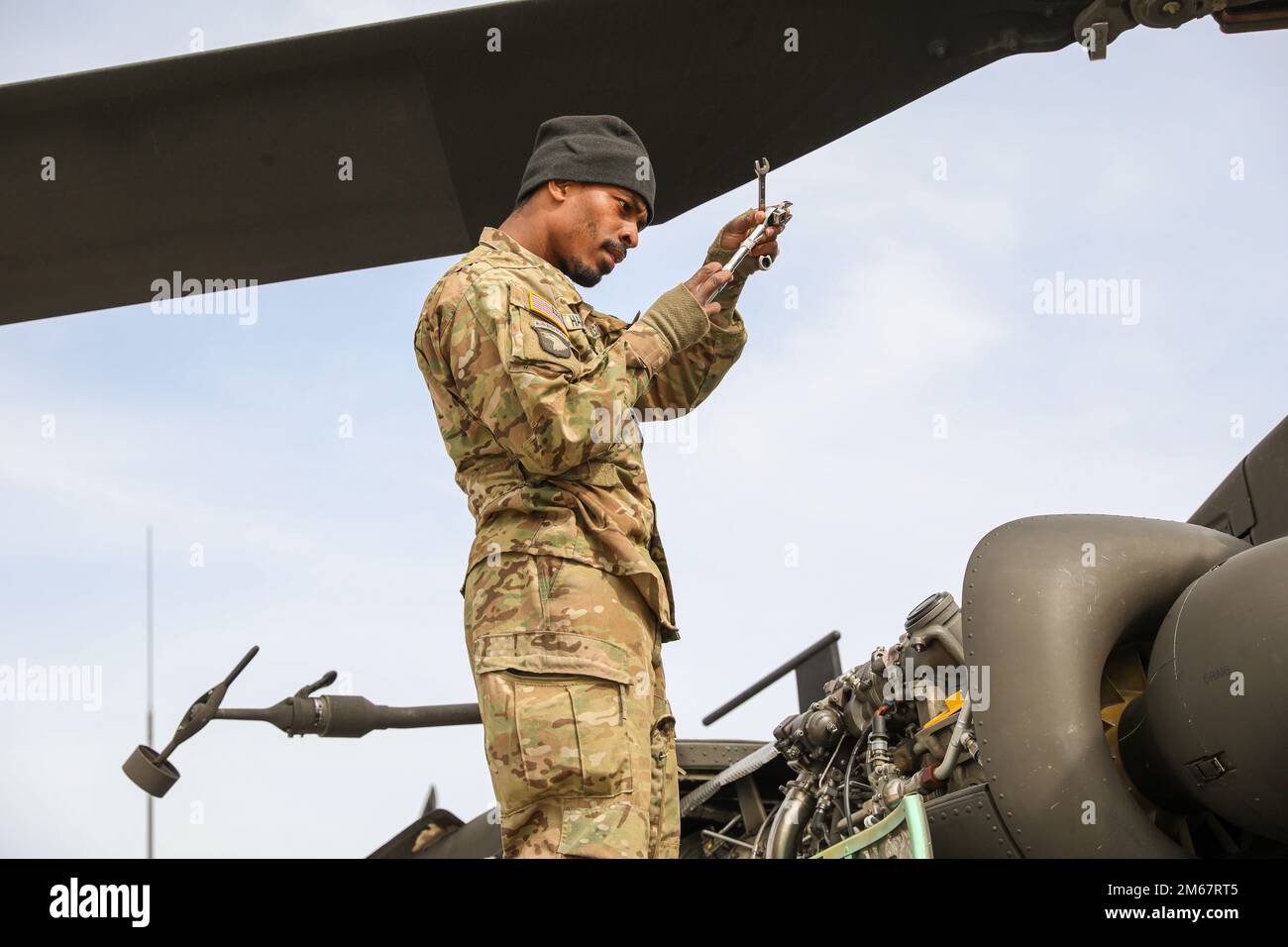 U.S. Army Staff Sgt. Eric Hawkins, an AH-64E helicopter repairer ...