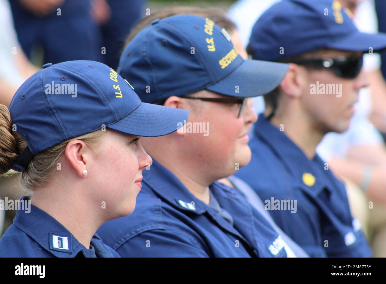Lt. Jessica Cooper (left) and Lt. Michael Cooper (center) attend the ...